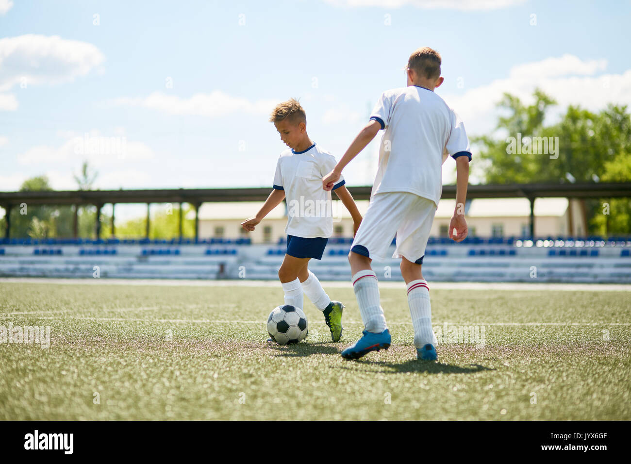 Boys Playing Football Outdoors Stock Photo - Alamy