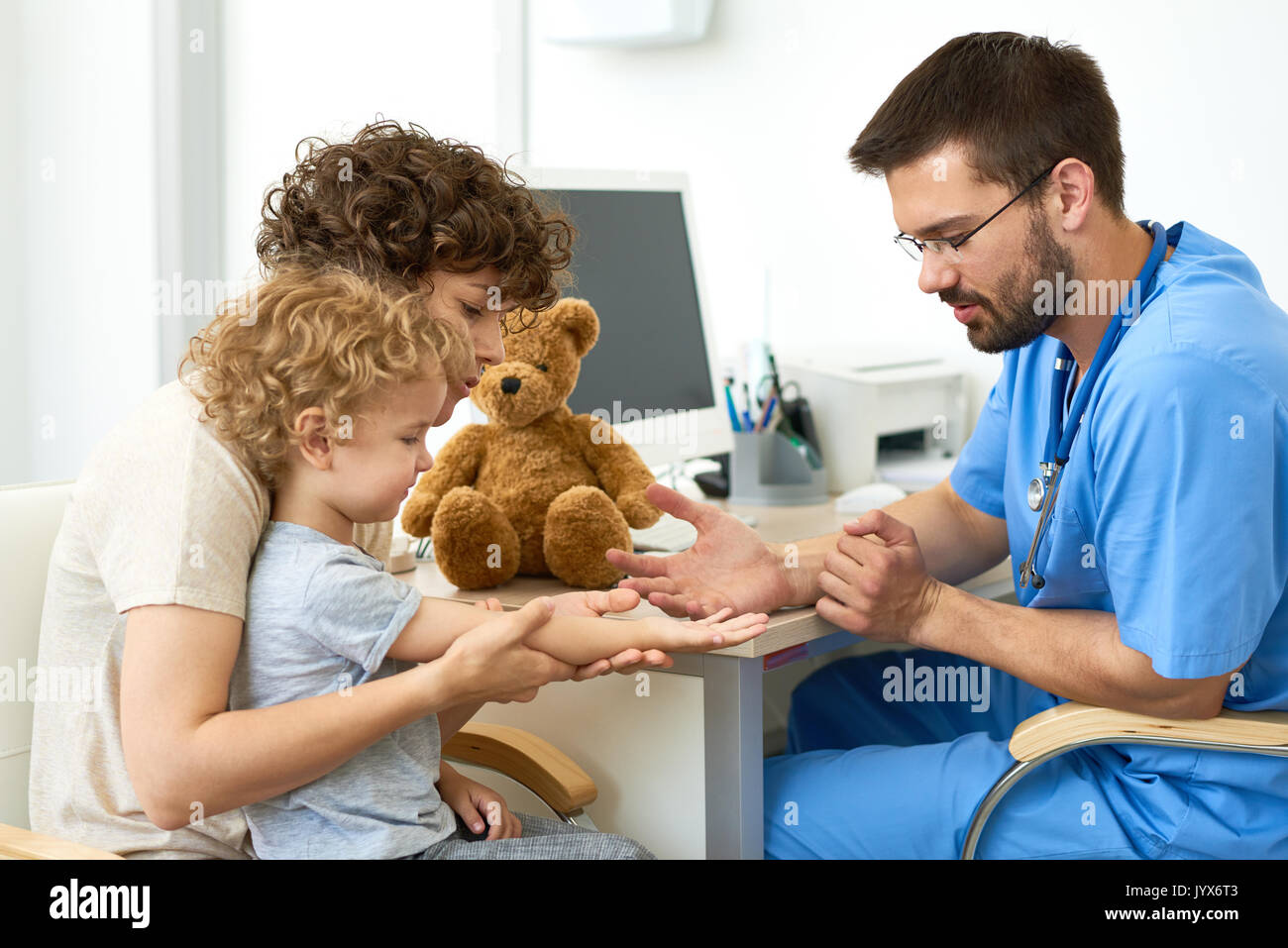 Pediatrician Working with Child in Office Stock Photo - Alamy