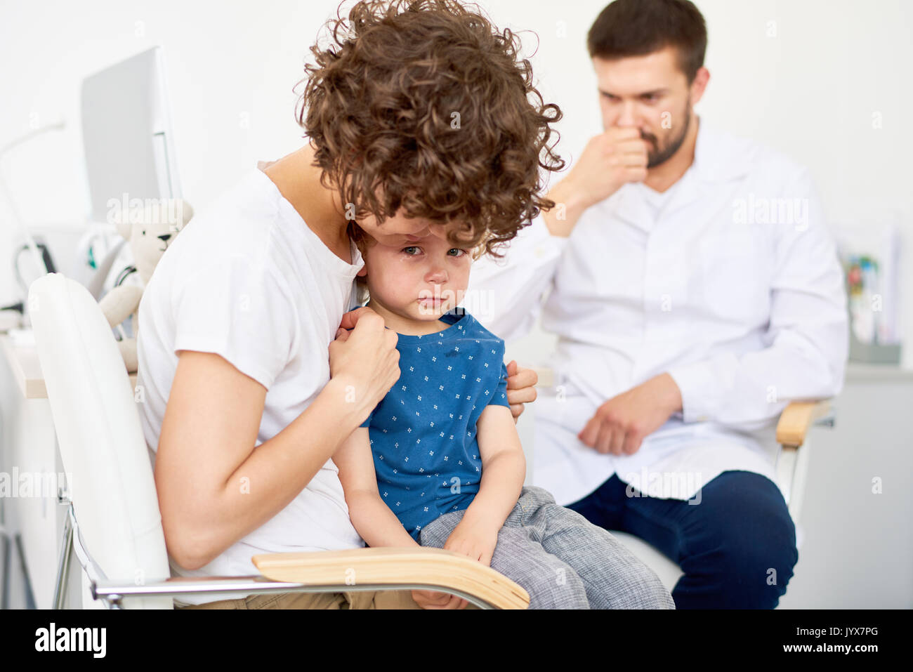 Crying Little Boy in Doctors Office Stock Photo - Alamy