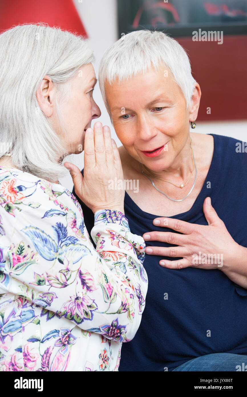 Whisper in ear hand hi-res stock photography and images - Alamy