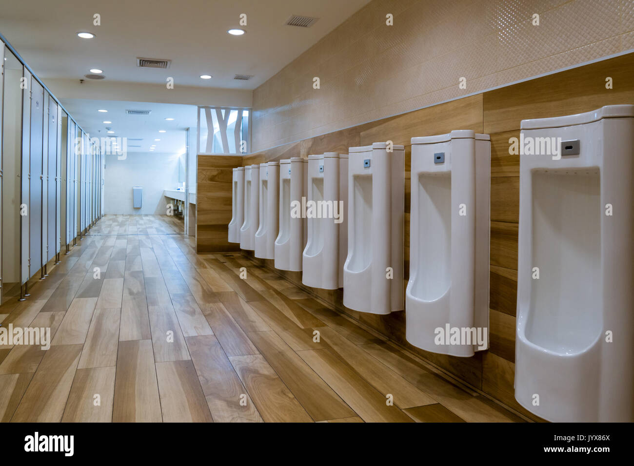 urinal row in a public restroom Stock Photo - Alamy