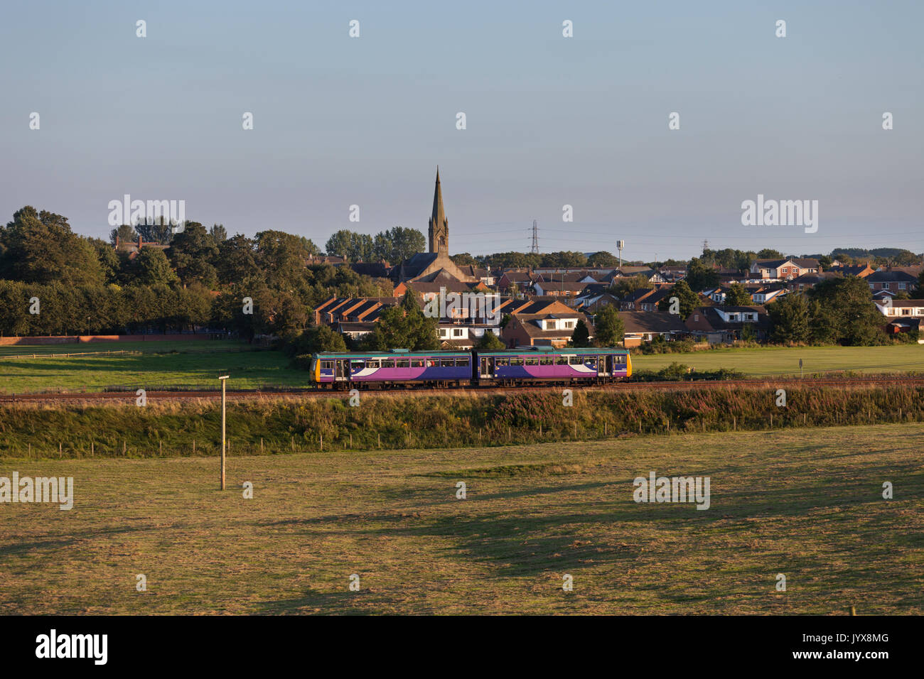 Northern Rail class 142 pacer train passes Kirkham and Wesham on the Preston - Blackpool line ...
