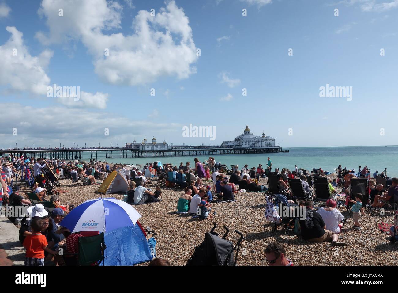 Crowds on eastbourne beach hi-res stock photography and images - Alamy
