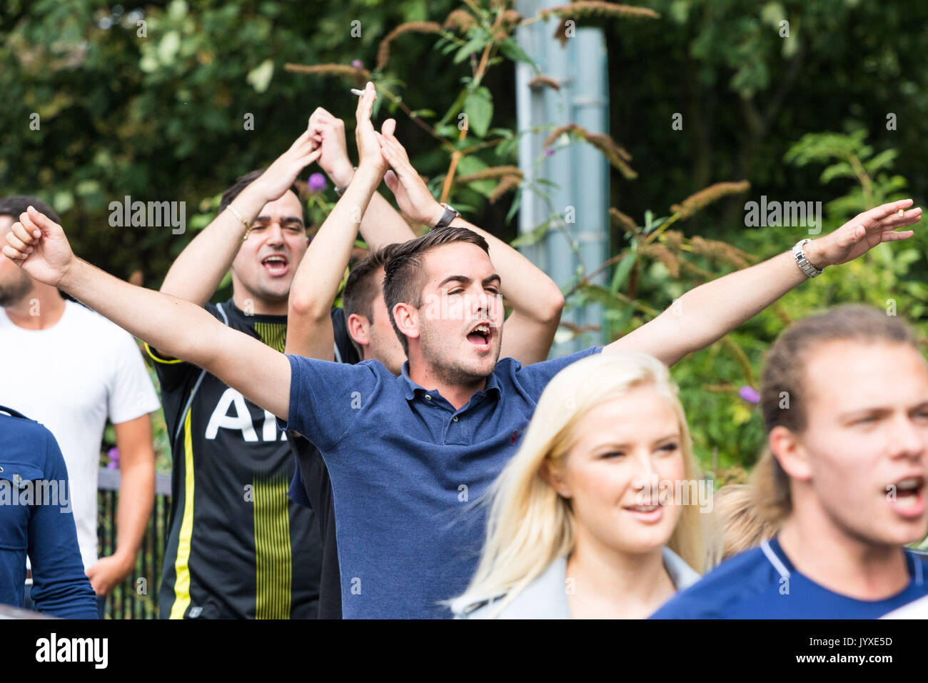 London, UK. 20th Aug, 2017. Spurs fans chant slogans as they make their ...