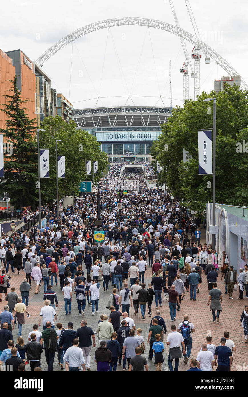 London, UK. 20th Aug, 2017. Crowds stream towards the stadium from ...