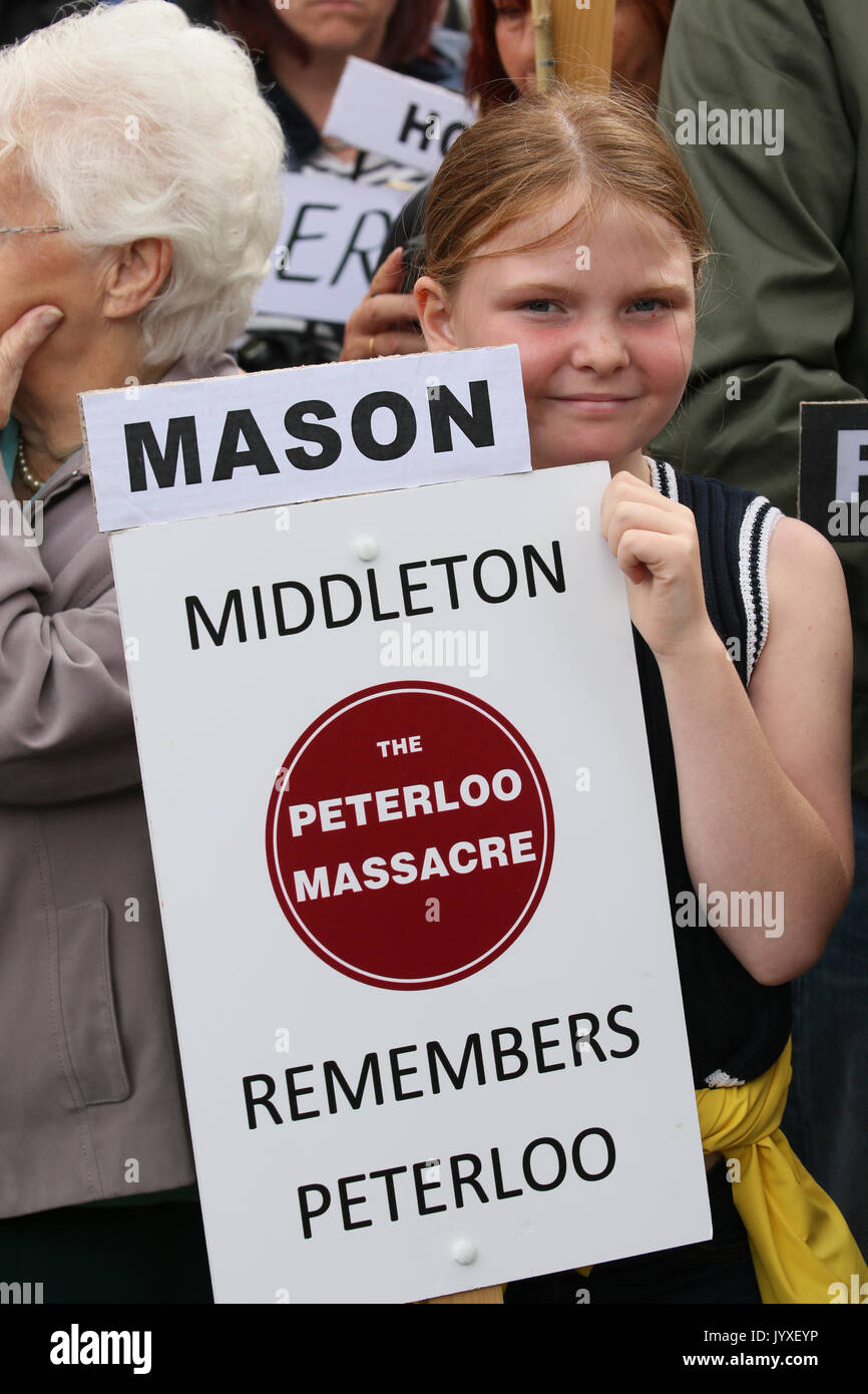 Manchester, UK. 20th Aug, 2017. A young girl stood with a placard which ...