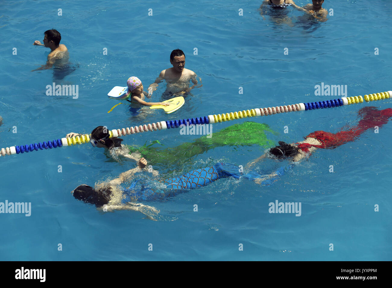 Chongqin, China. 21st Aug, 2017. Women wearing costumes of mermaids ...