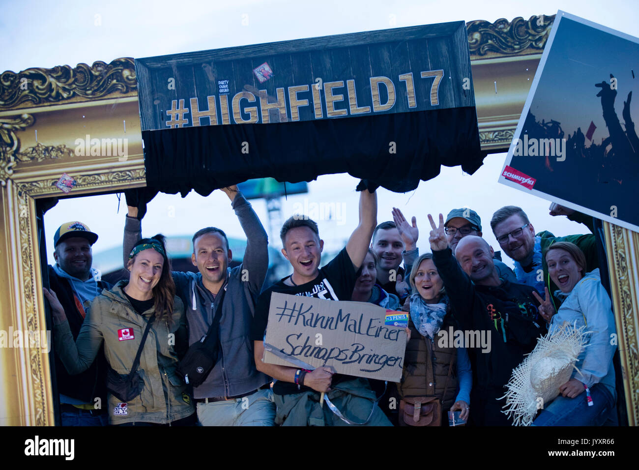 Highfield Festival-goers pose for a picture with a festival sign in ...