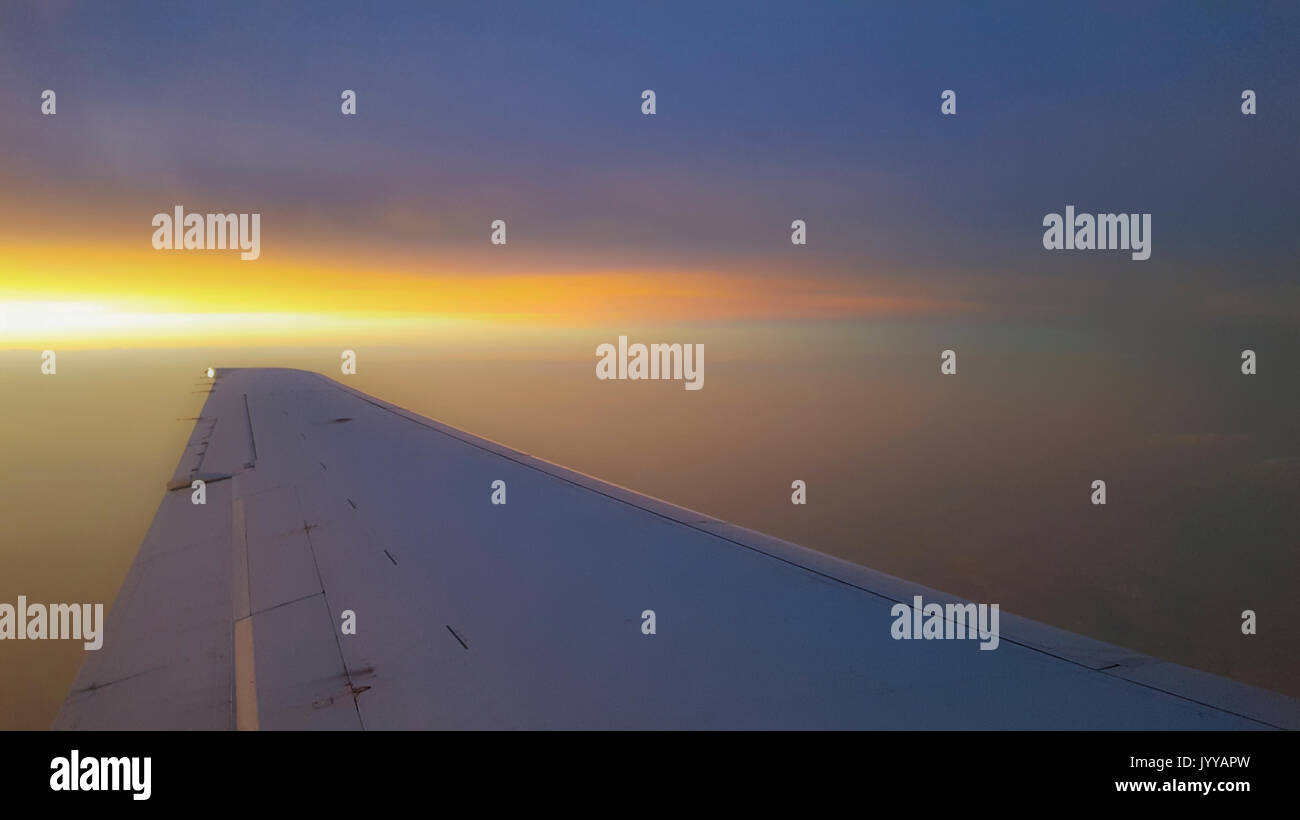 Airplane Wing At Sunset Stock Photo - Alamy