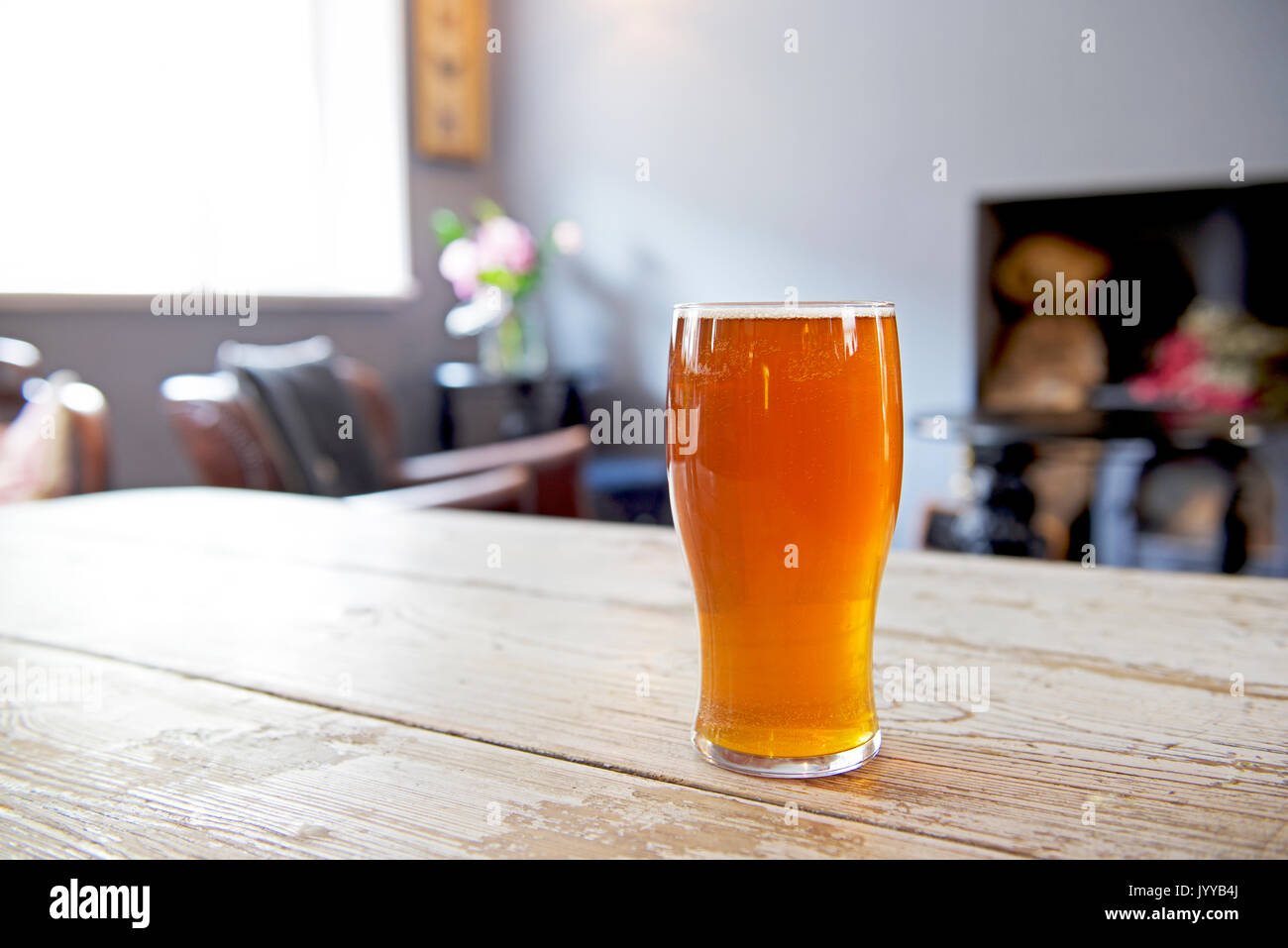 Pint of beer on table in the bar of the Lynn Arms, in the village of ...