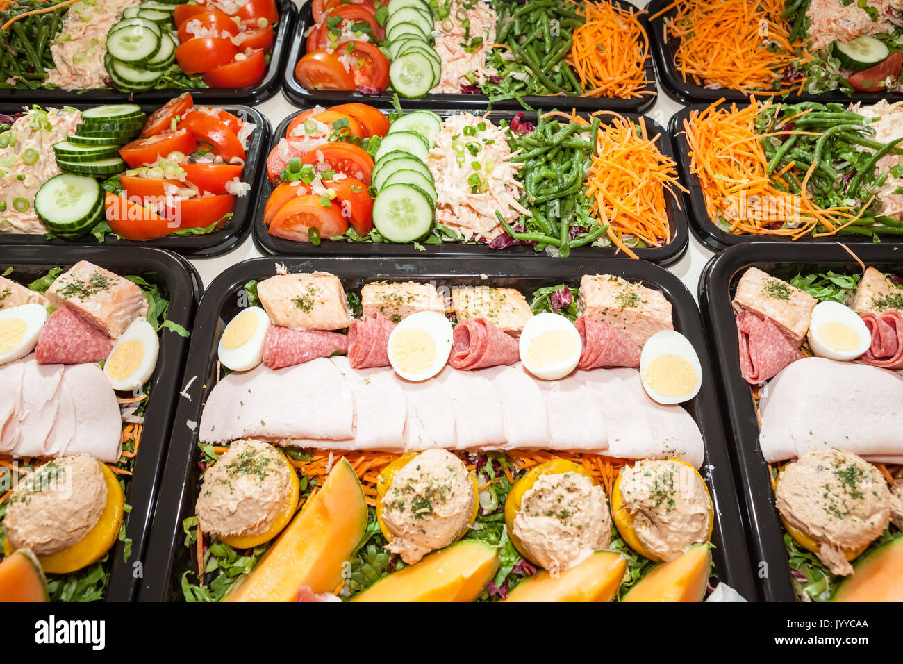 On plastic plates there is cold food Stock Photo - Alamy