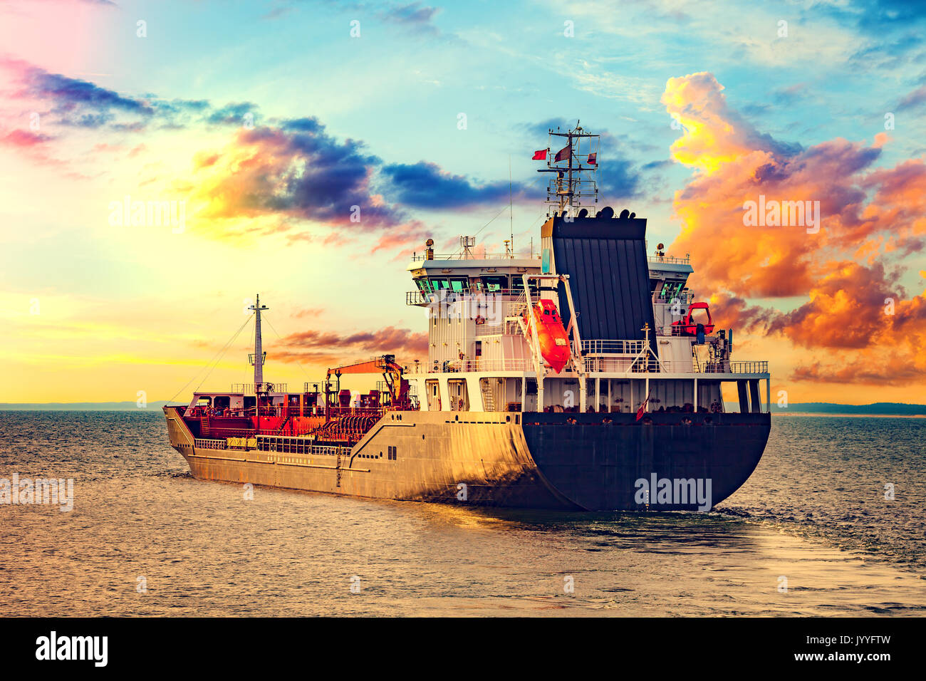 Shipping vessel sunset hi-res stock photography and images - Alamy