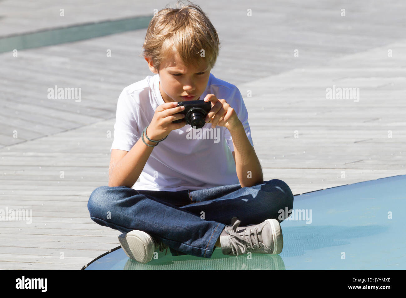 Boy taking picture digital camera hi-res stock photography and images ...