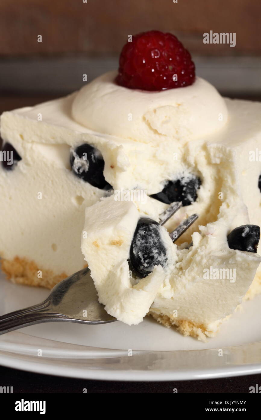 Frozen cheesecake with blueberry and raspberry Stock Photo - Alamy