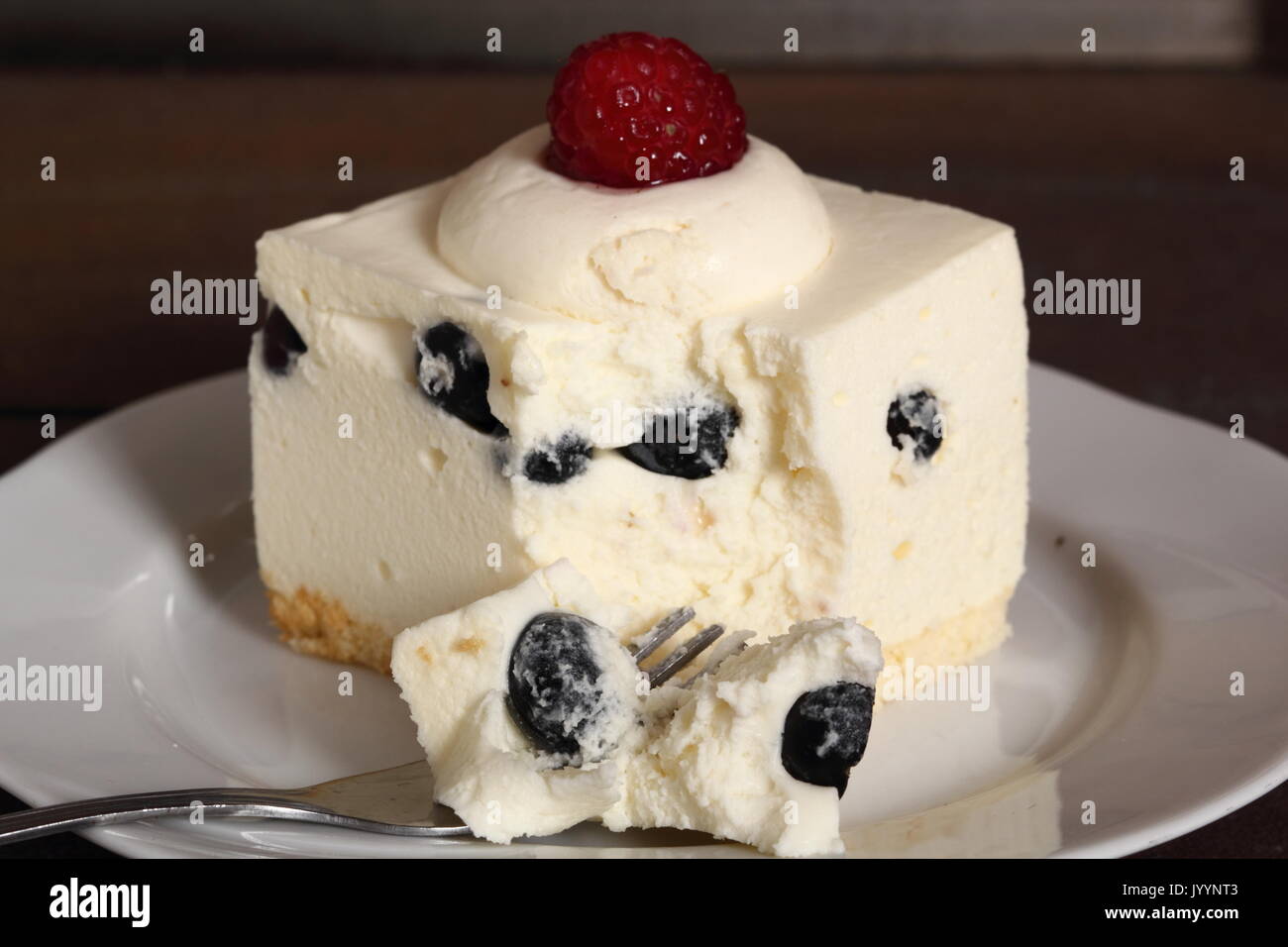 Frozen cheesecake with blueberry and raspberry Stock Photo - Alamy