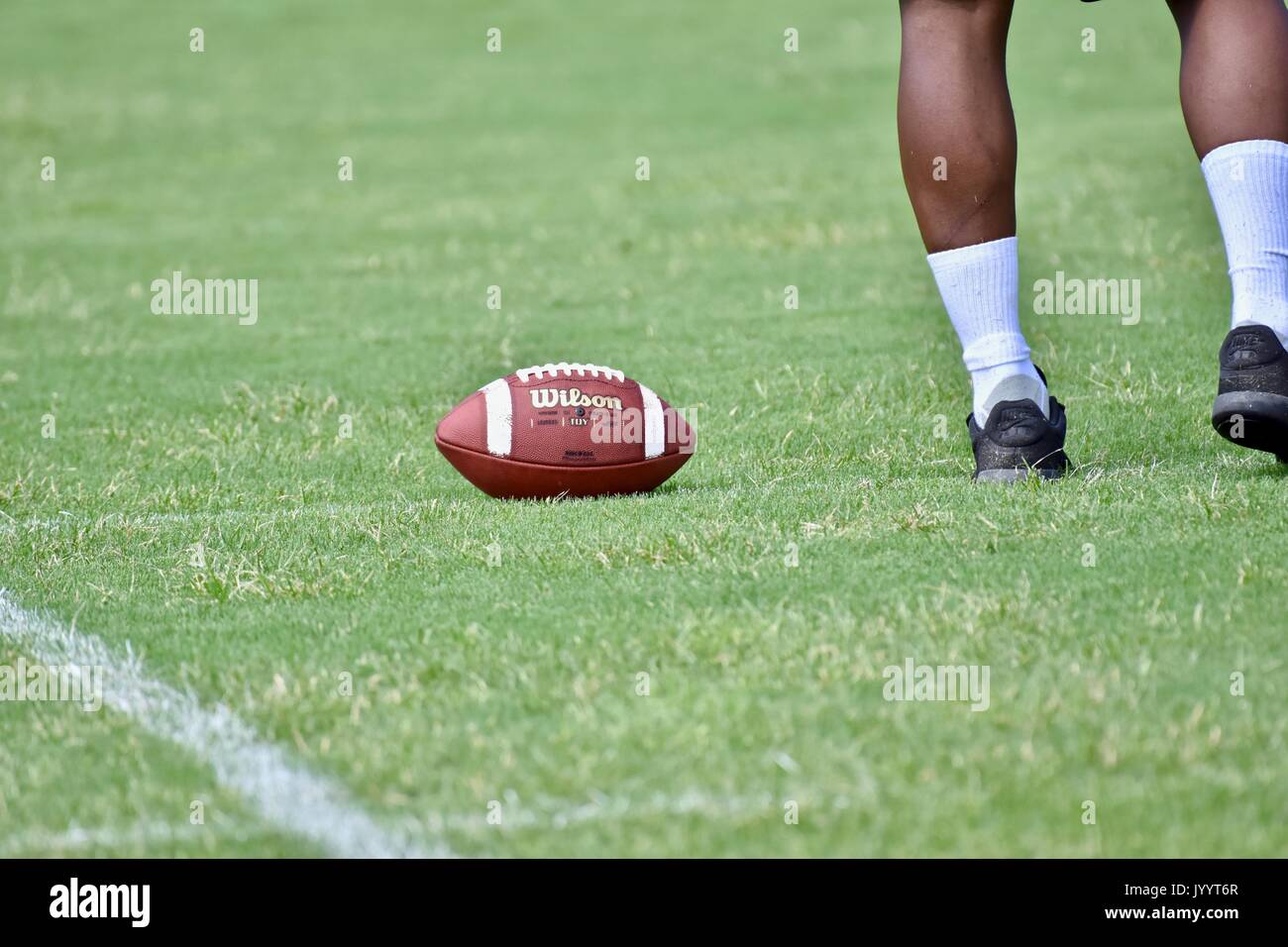 American football on field next to referee Stock Photo - Alamy