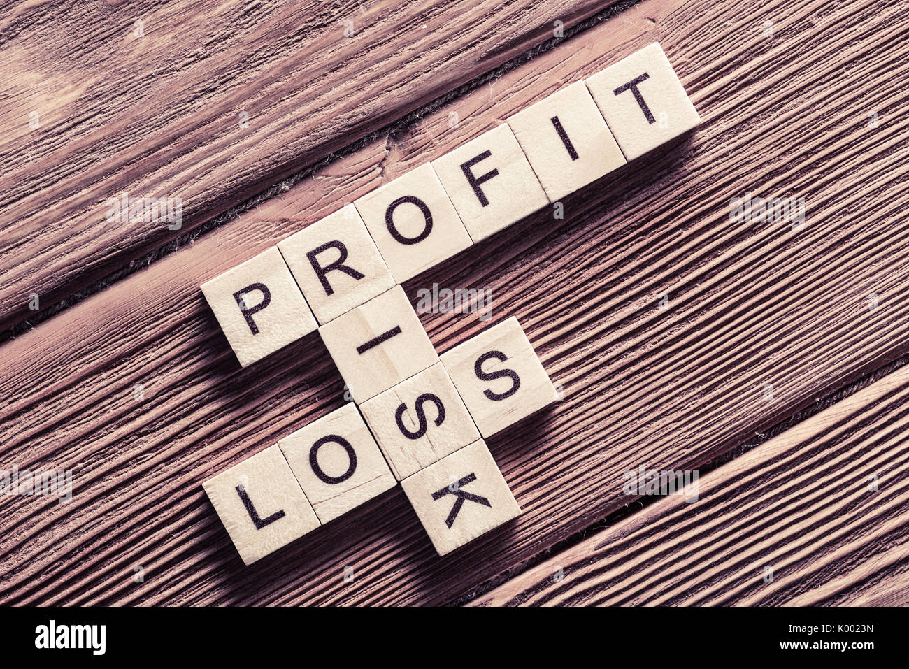Profit loss and risk words on workplace collected of wooden cube Stock ...