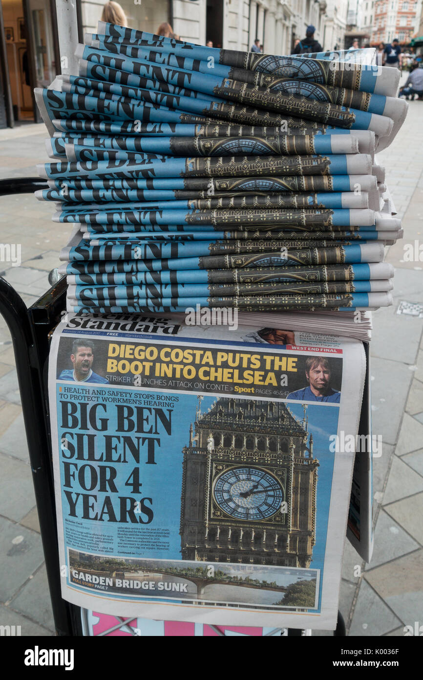News stand with stacked evening standard newspapers showing image of ...