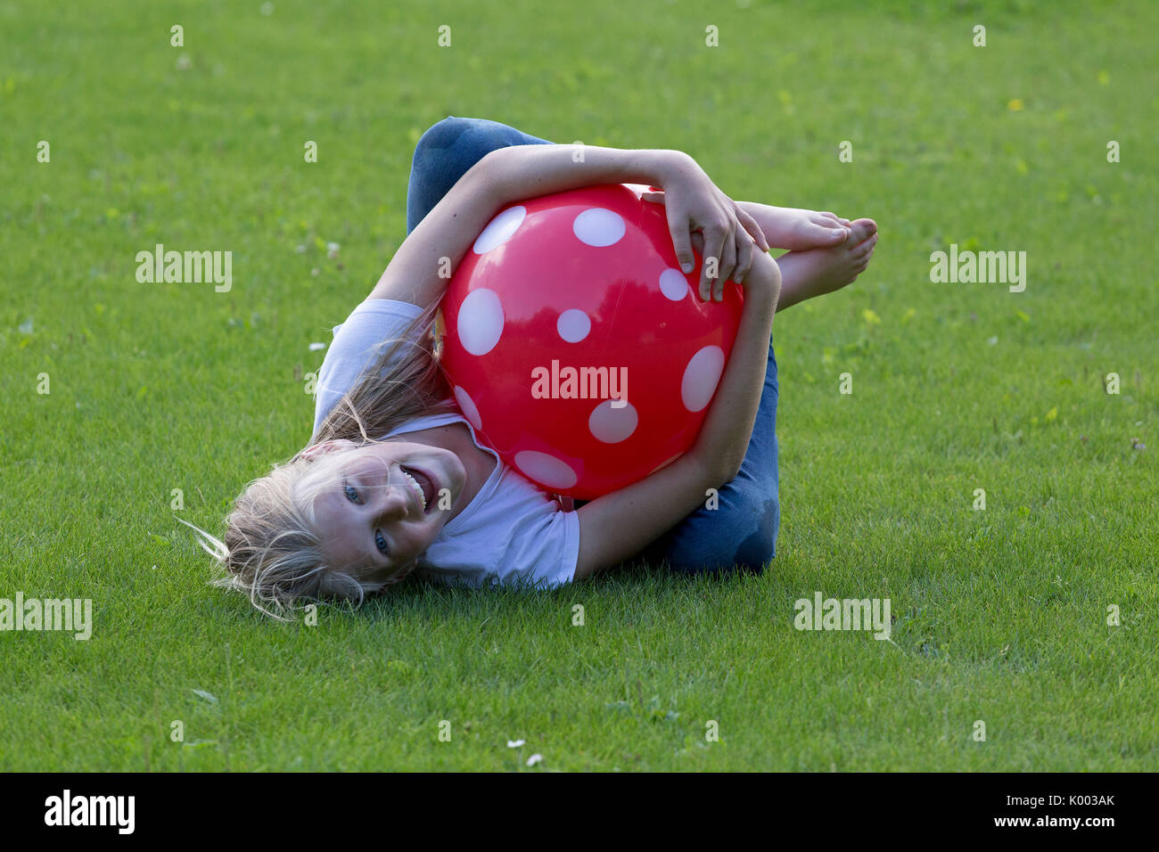 young girl having fun with a big ball Stock Photo - Alamy