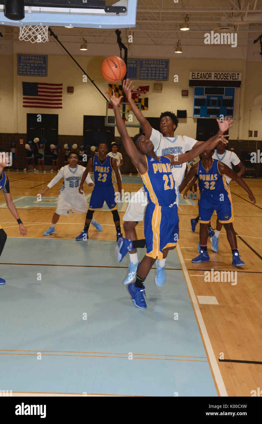 basketball player goes up for a basket in a basketball game Stock Photo ...