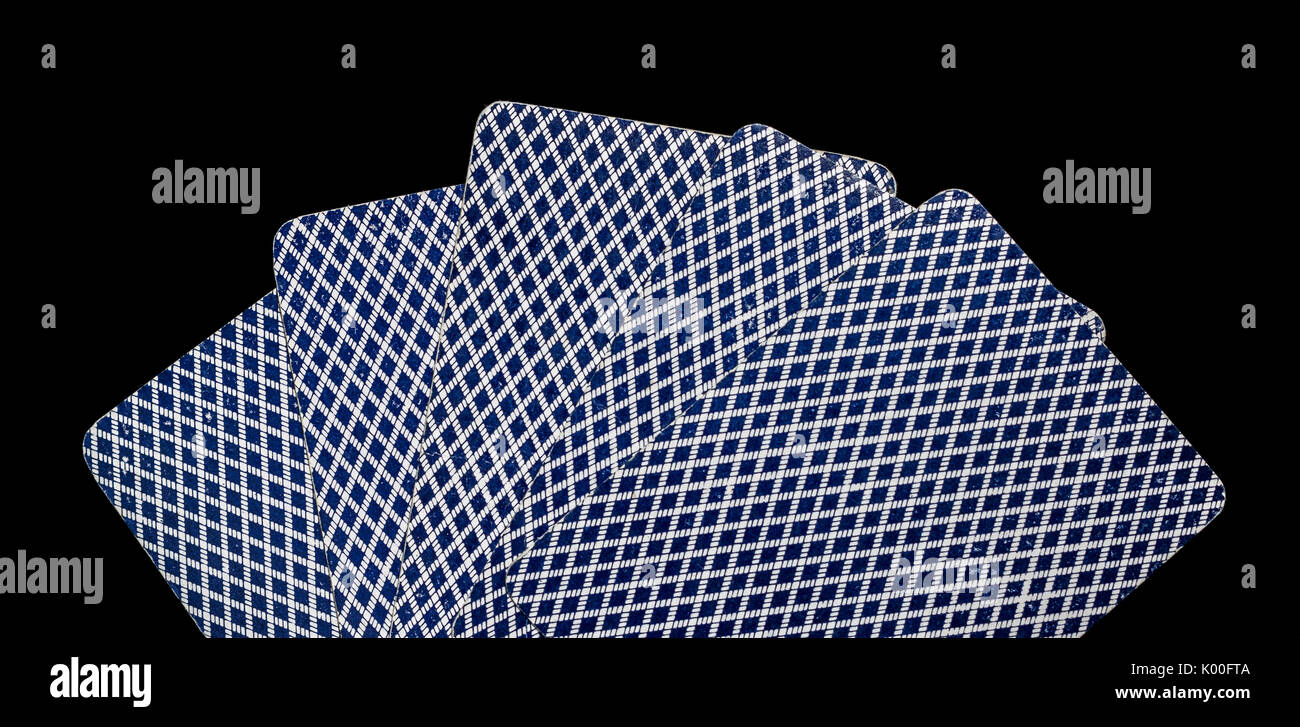 Spread playing cards deck, on a black reflective background, with ...