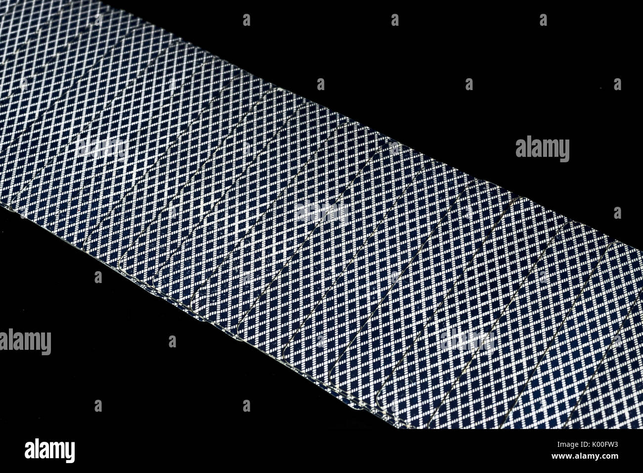 Spread playing cards deck, on a black reflective background, with ...