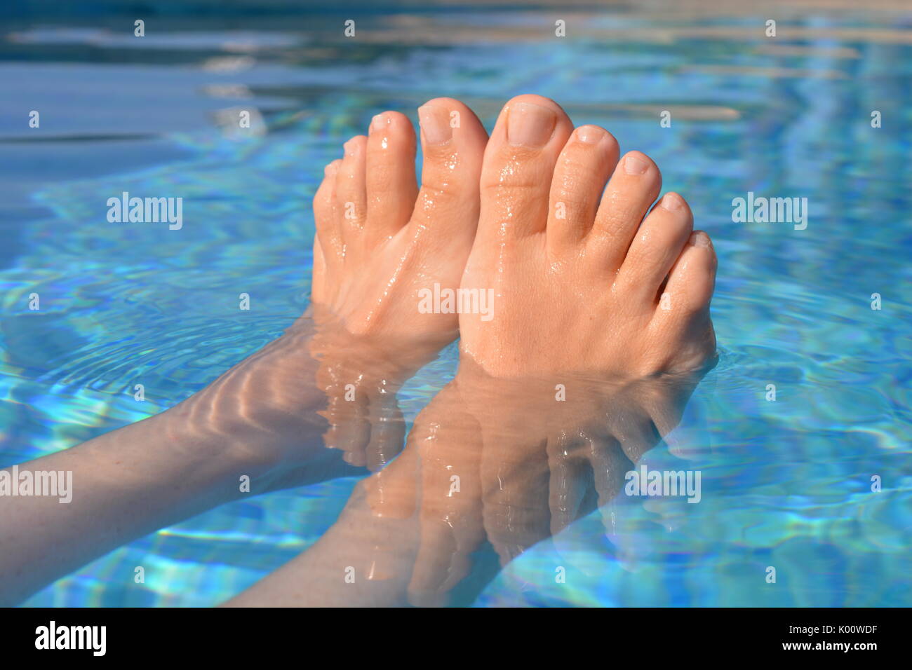 Woman feet up pool hi-res stock photography and images - Alamy
