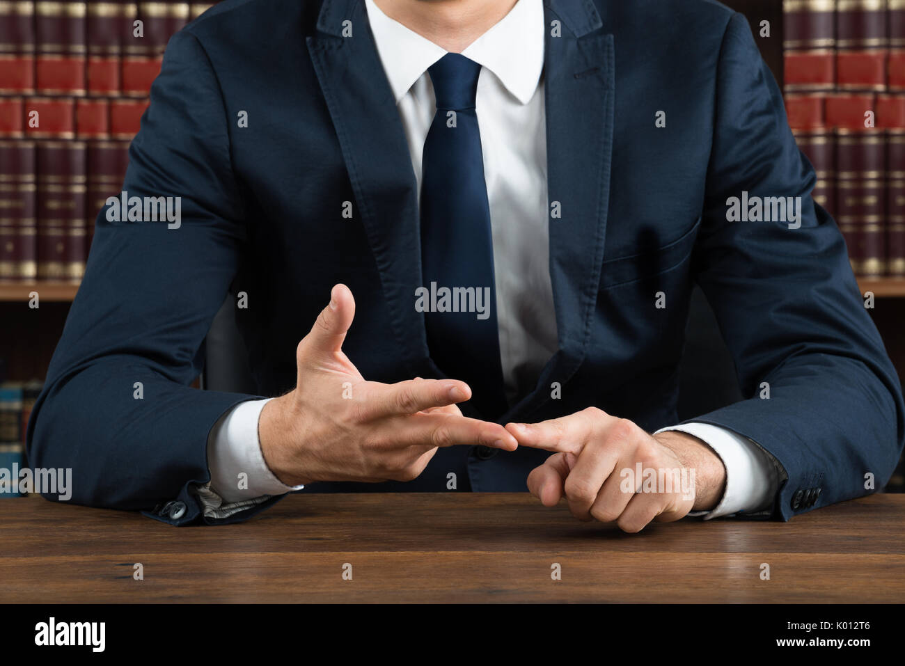 Lawyer sitting desk hi-res stock photography and images - Alamy