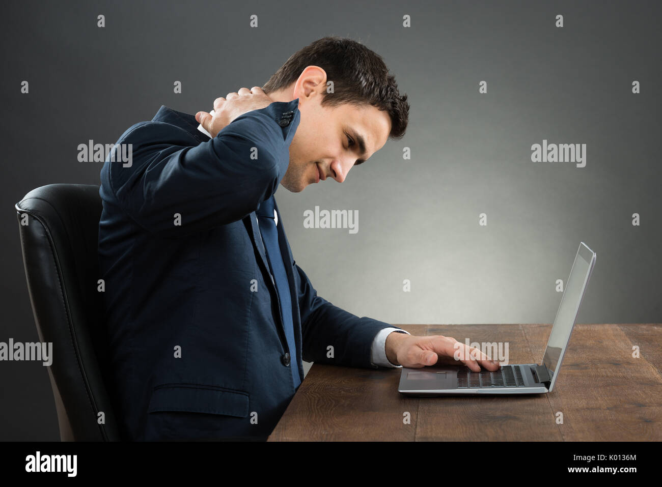 Businessperson looking laptop side view hi-res stock photography and ...