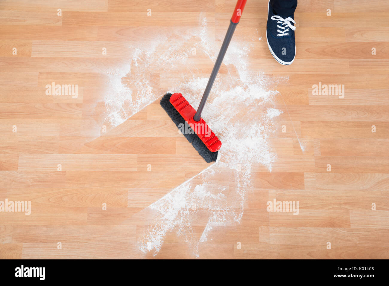 Low section of man sweeping hardwood floor at home Stock Photo - Alamy