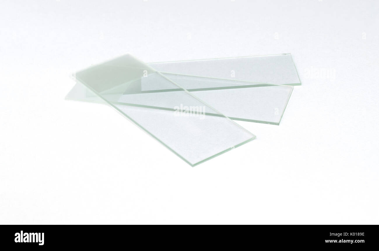 Three spread Glass Microscope Slides, white background isolated Stock ...