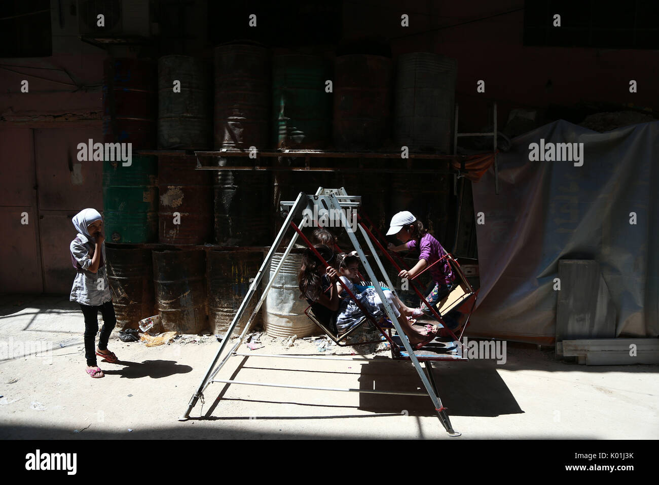 Children playing holes hi-res stock photography and images - Alamy
