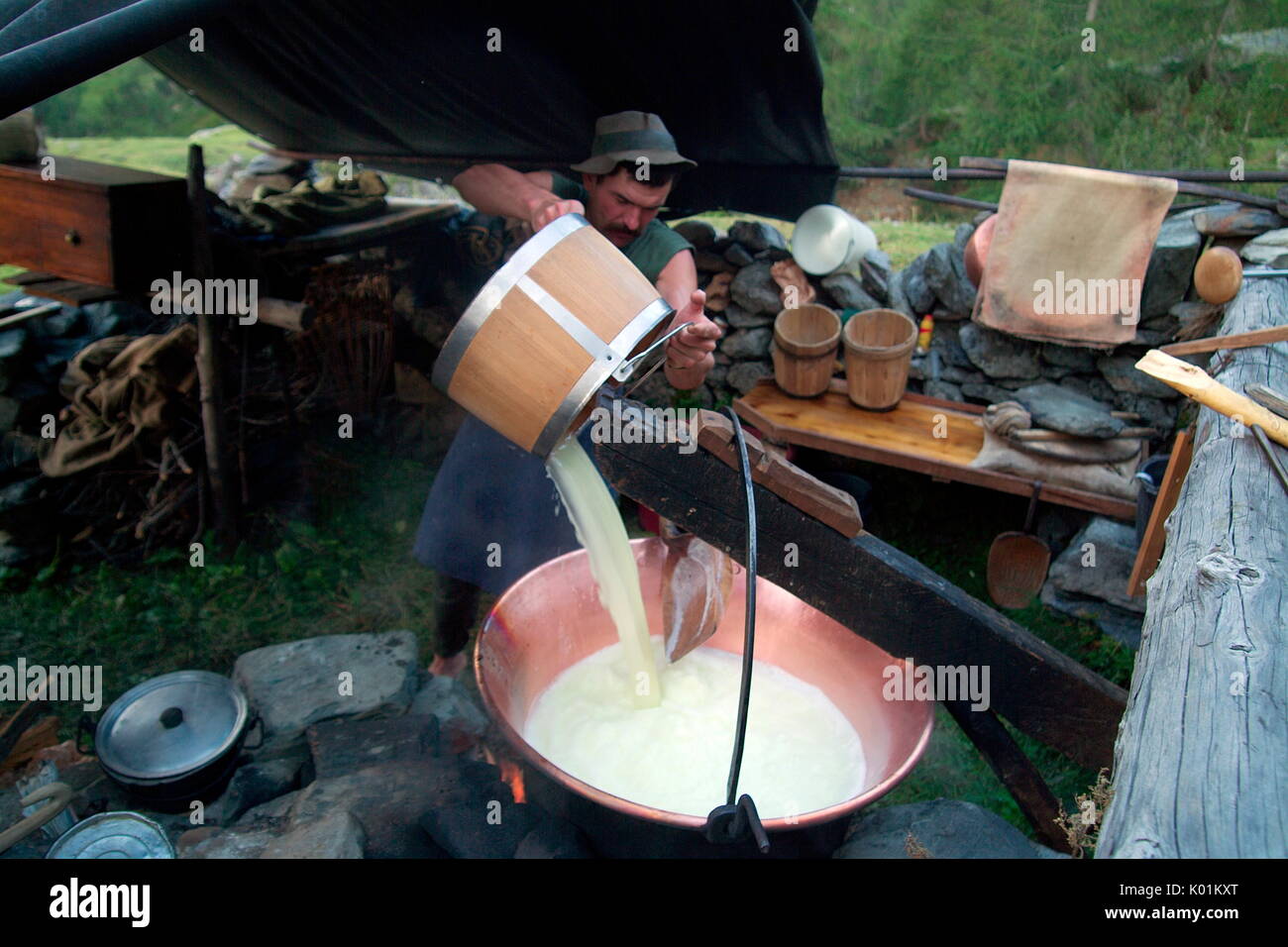 Producing Bitto cheese in Valli del Bitto, Gerola Valley, Italy. Cow's ...