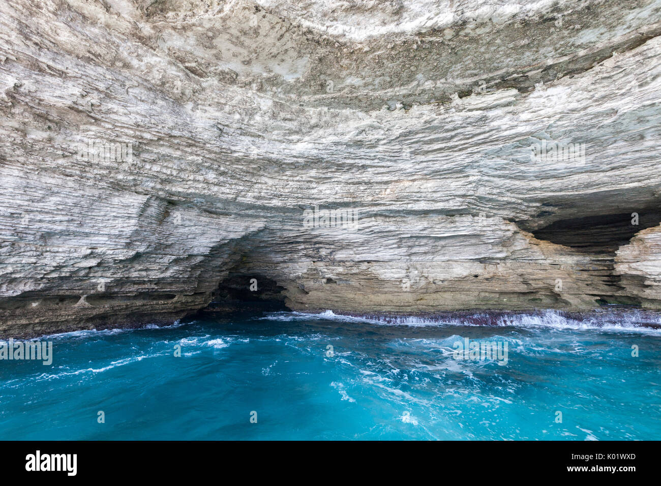 The turquoise sea framed by granite white cliffs and sea caves Lavezzi ...