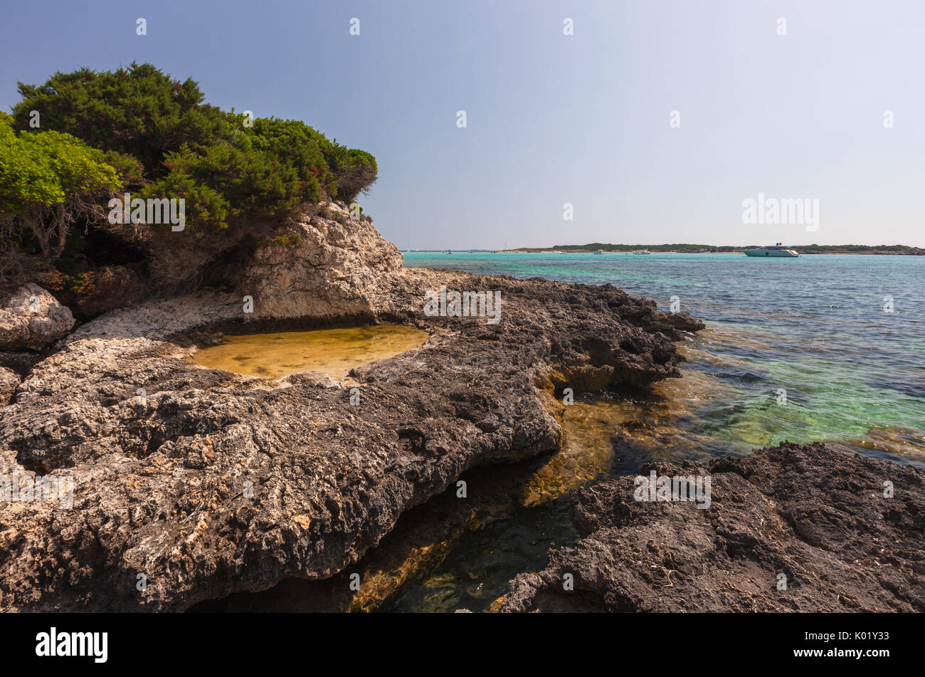 Natural pools and limestone rocks frame the turquoise sea Sperone ...