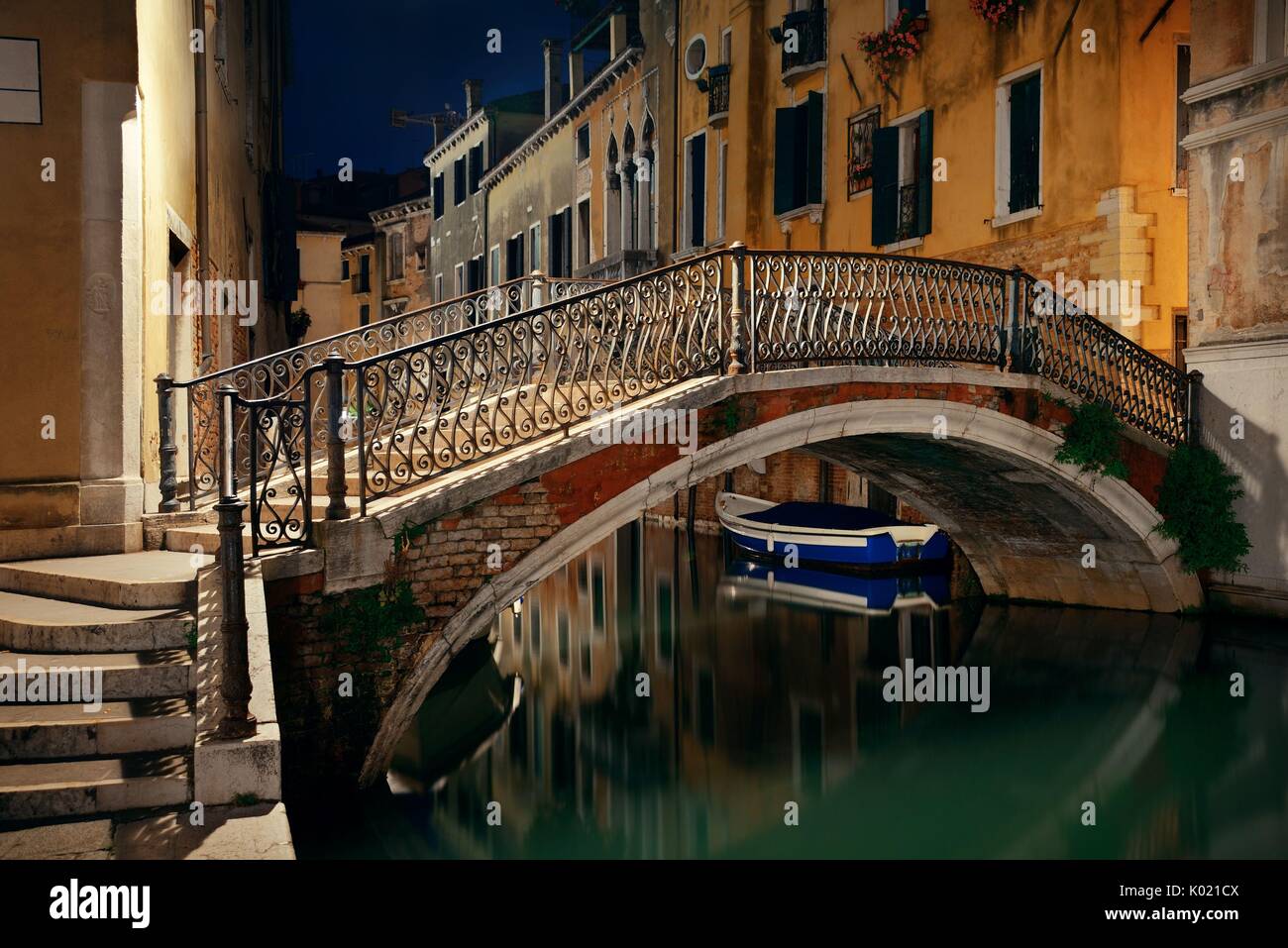 Venice canal view at night with bridge and historical buildings. Italy Stock Photo - Alamy