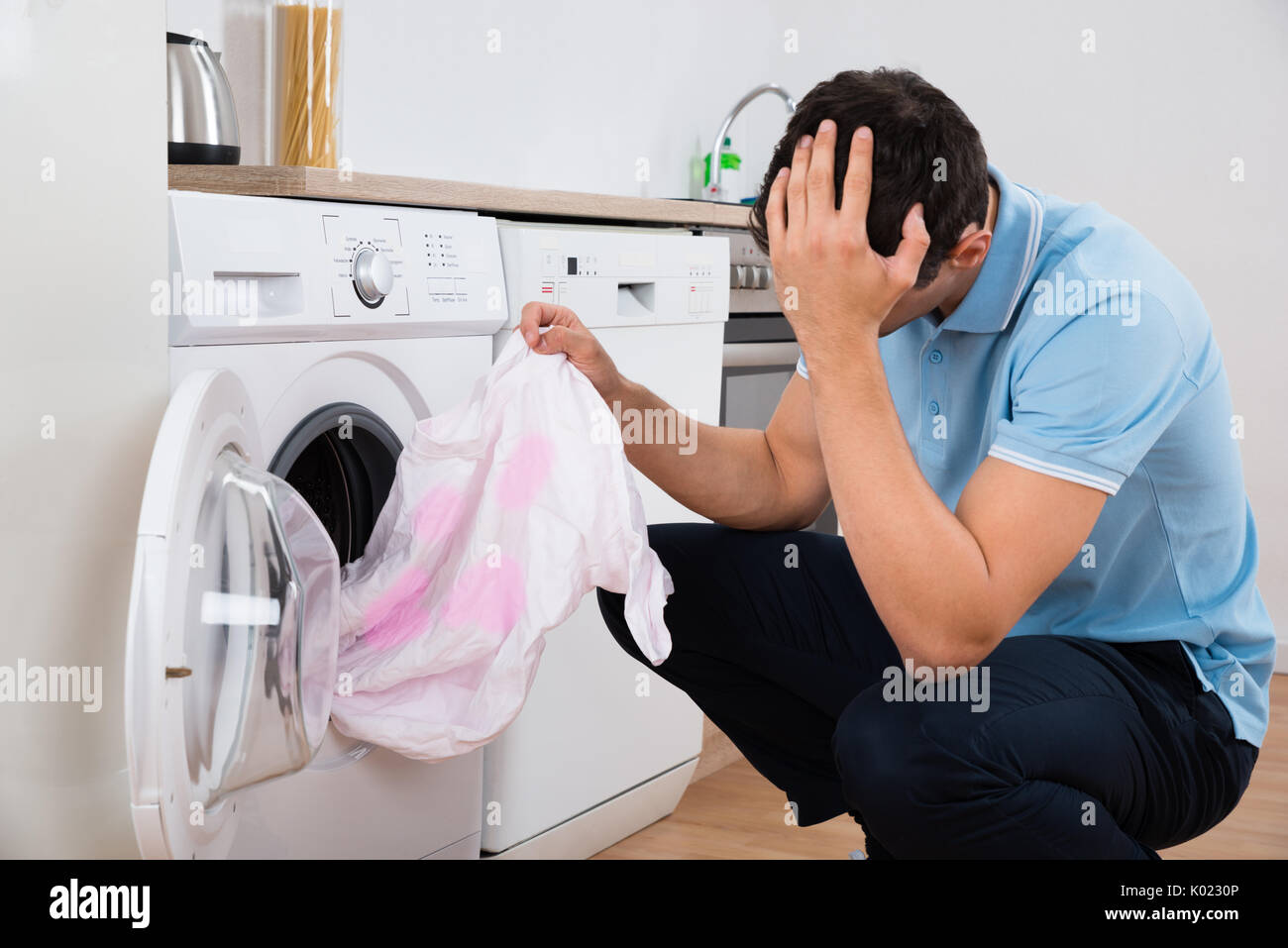 Man washing clothes by hand hi-res stock photography and images - Alamy