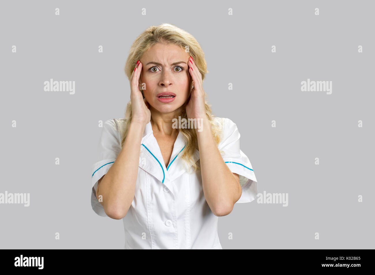 Shocked and scared female nurse or doctor. Attractive young nurse ...