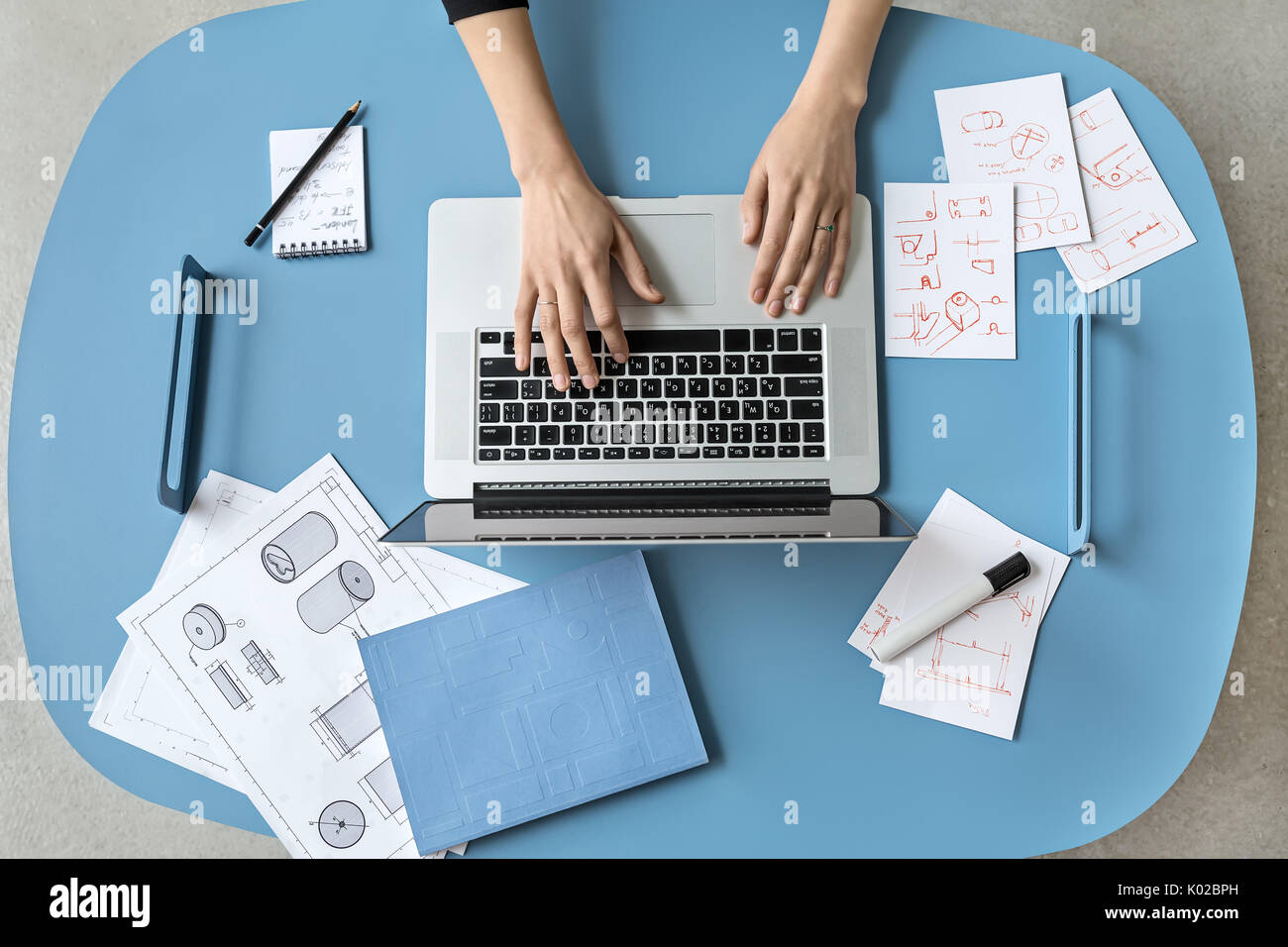 Girl using laptop in office Stock Photo - Alamy