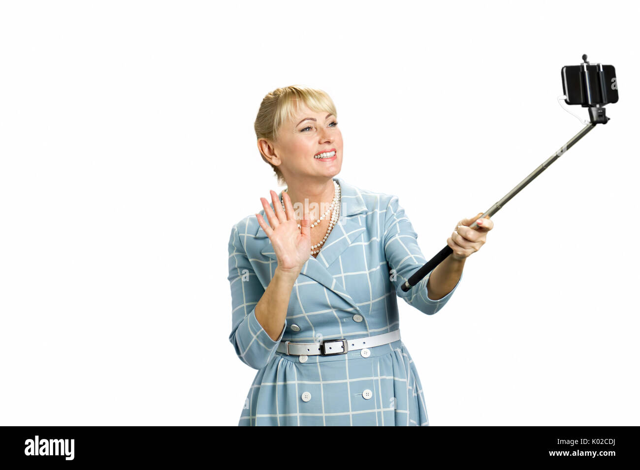 Happy mature businesswoman waving hi-res stock photography and images ...