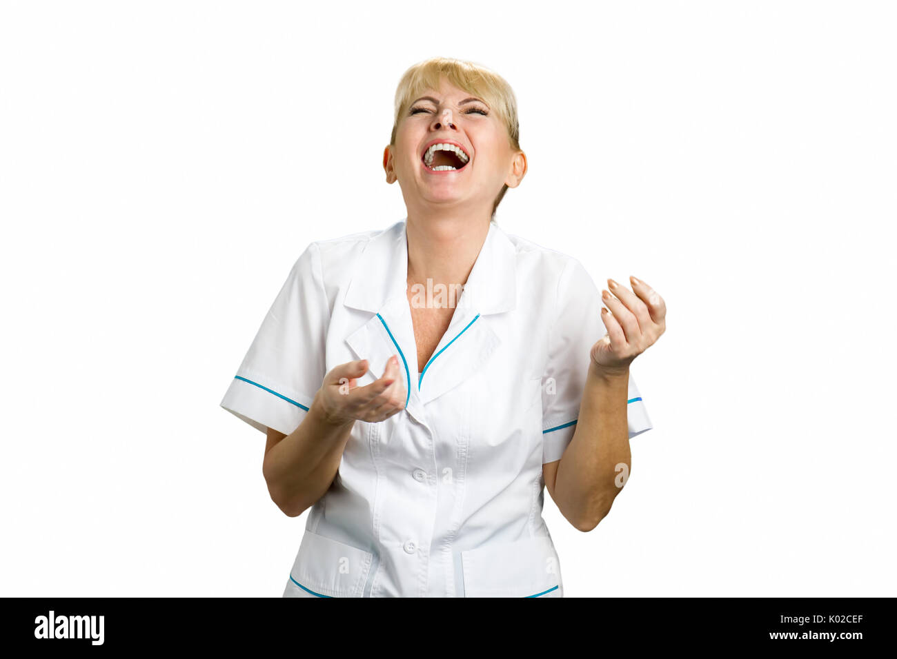 Laughing nurse on white background. Portrait of excited nurse or doctor ...