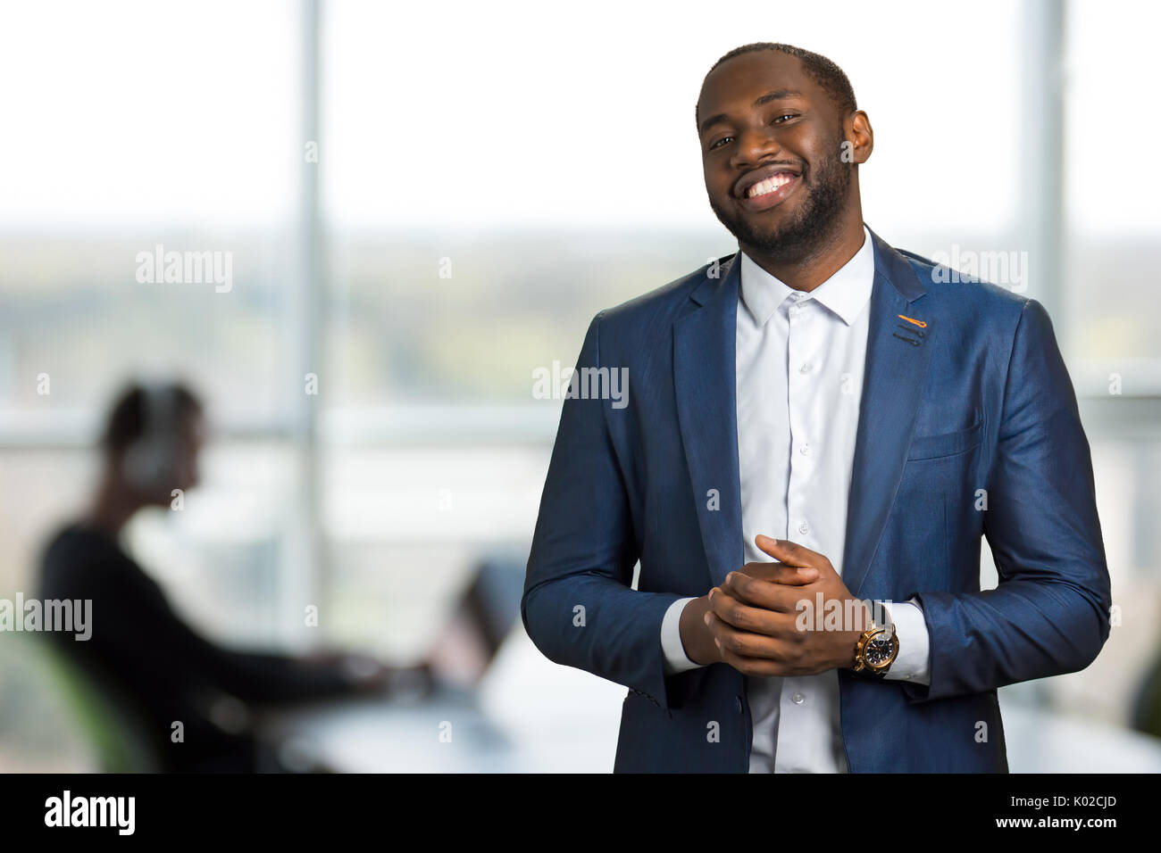 Smiling black businessman in office. Afro american man in suit in good ...