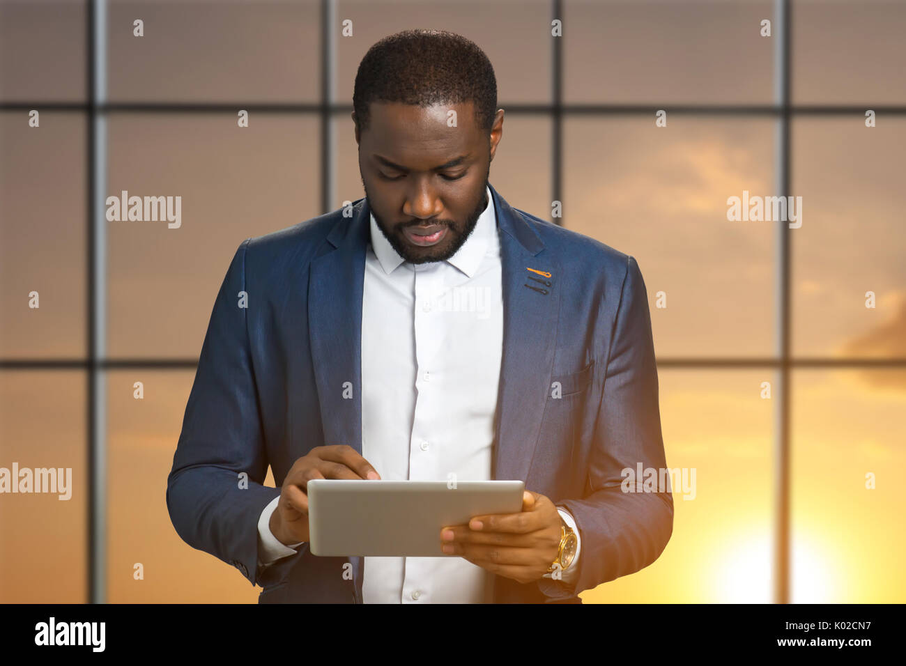 Successful businessman on sunlight background. Young project manager ...