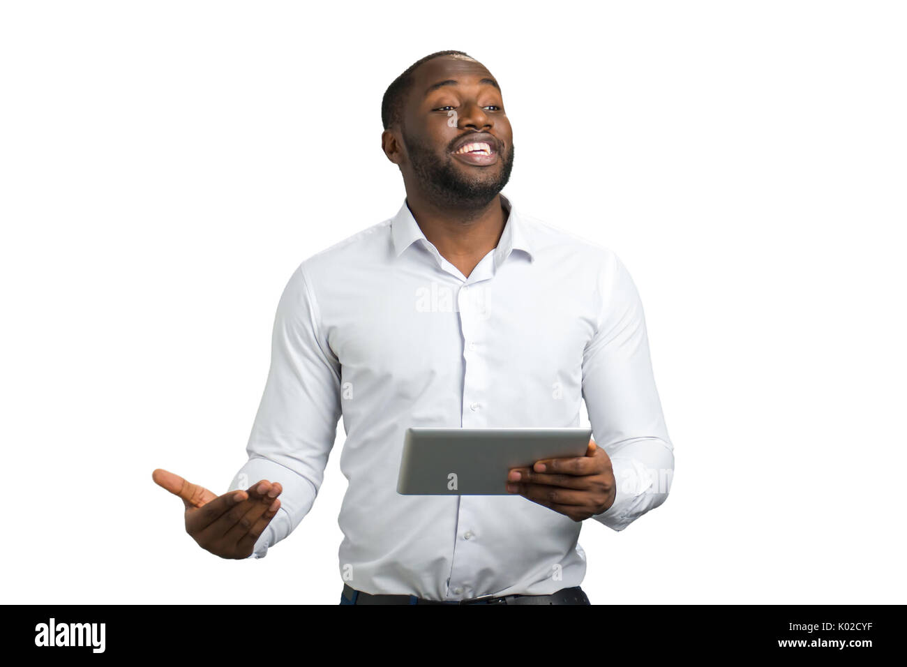 Gesticulating businessman with digital tablet. Speaking young manager ...