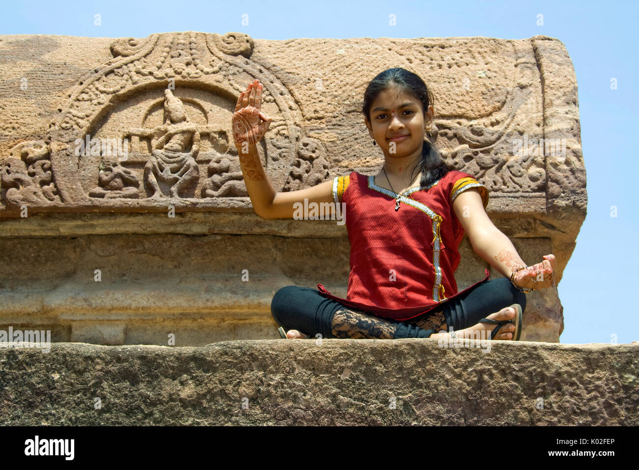 Girl sitting on stone platform in a dance pose Uploaded on 27jul17 ...