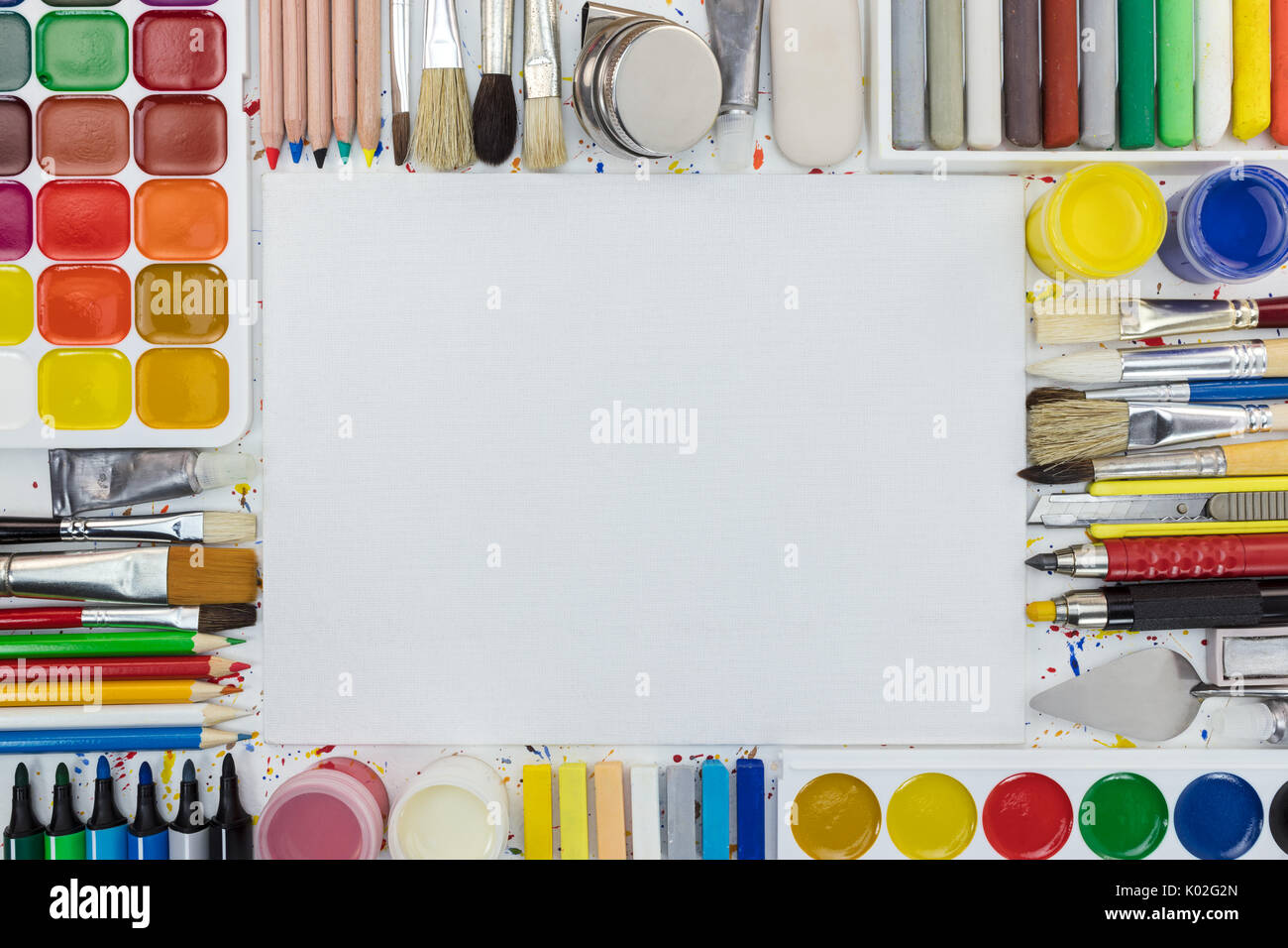 colorful artist tools and accessories frame on white background with ...