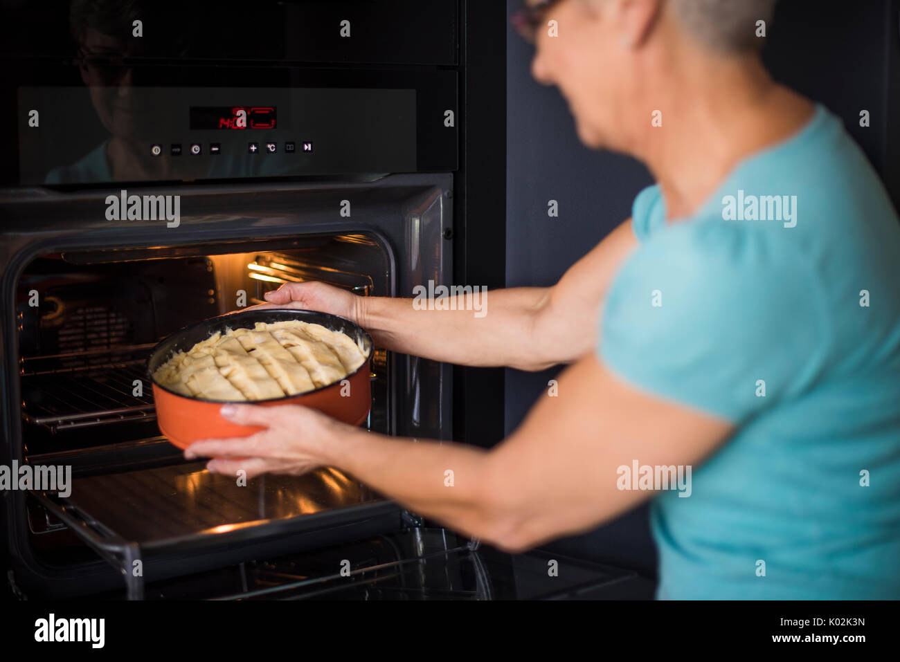 Delicious apple pie will be ready soon Stock Photo - Alamy