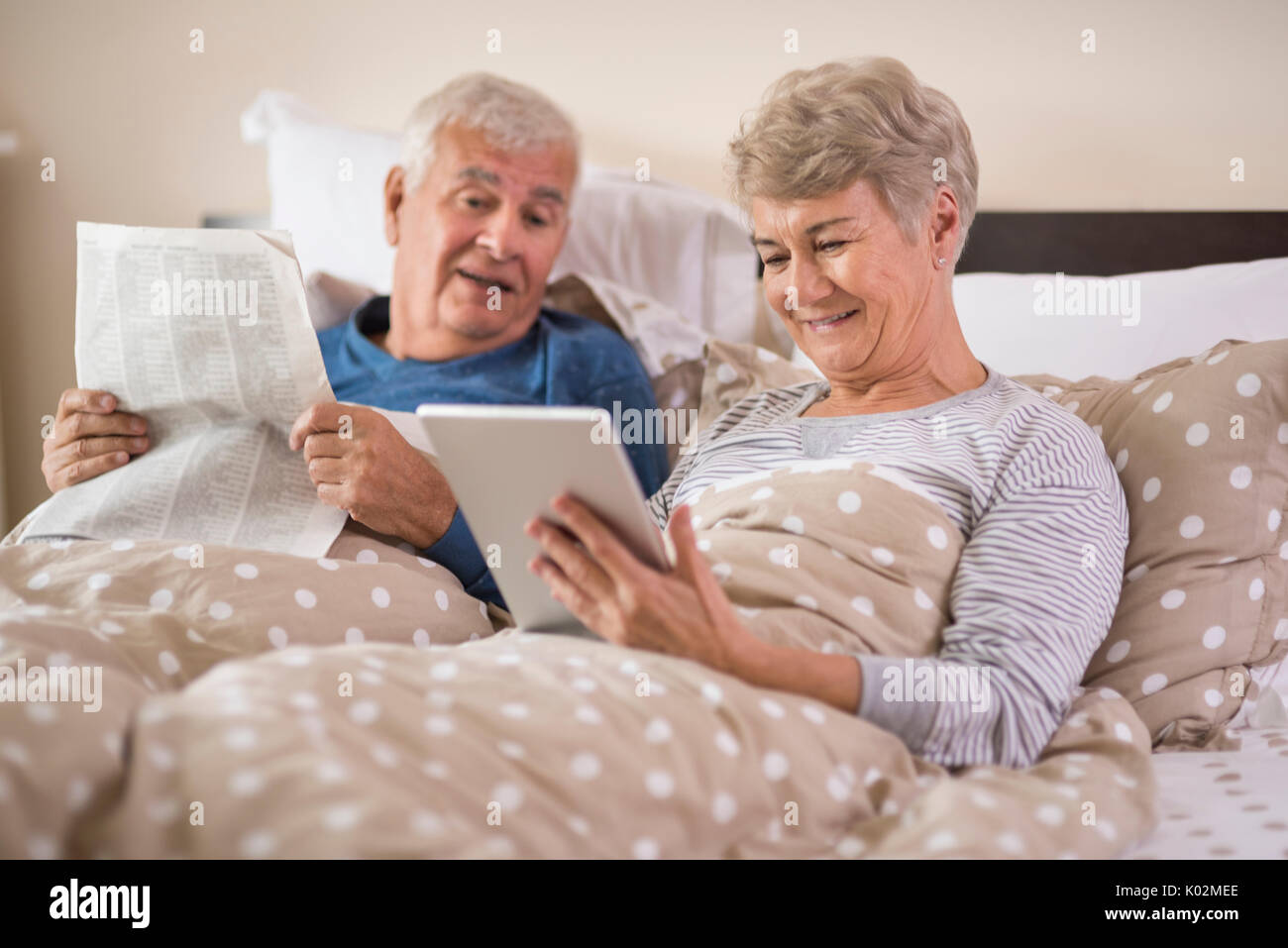 Modern grandmother and traditional grandfather in the morning Stock ...