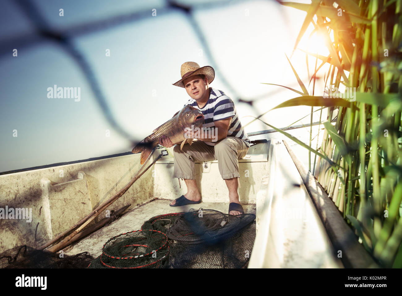 Man catching a big fish hi-res stock photography and images - Alamy
