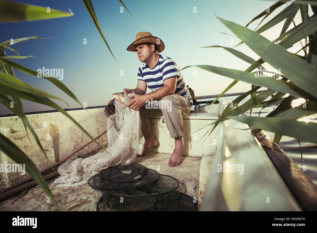 Fisherman at work Stock Photo - Alamy